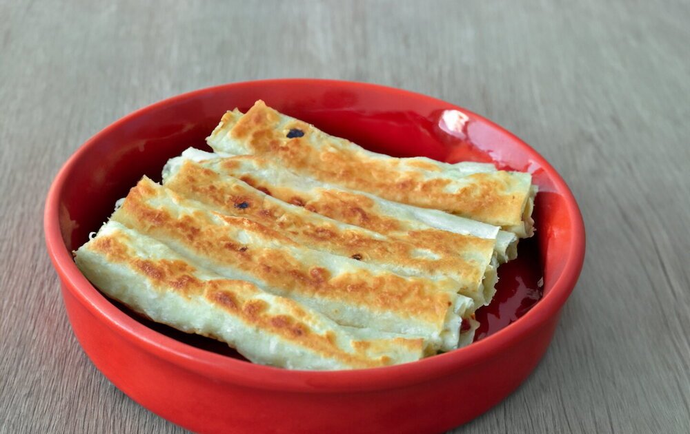 Lavash with Sausage, Cheese, and Egg in a Frying Pan